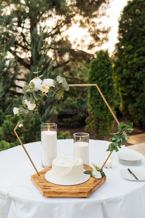 Wedding Cake for Newlyweds on a Wooden Stand Stock Photo - Image of ...