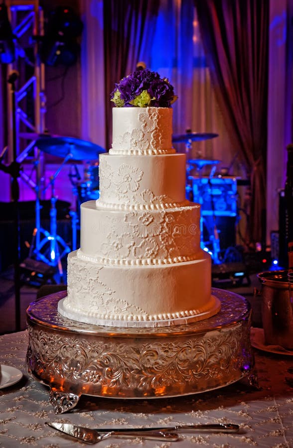 Wedding Cake With Purple Flower Topper Stock Image - Image of catering ...