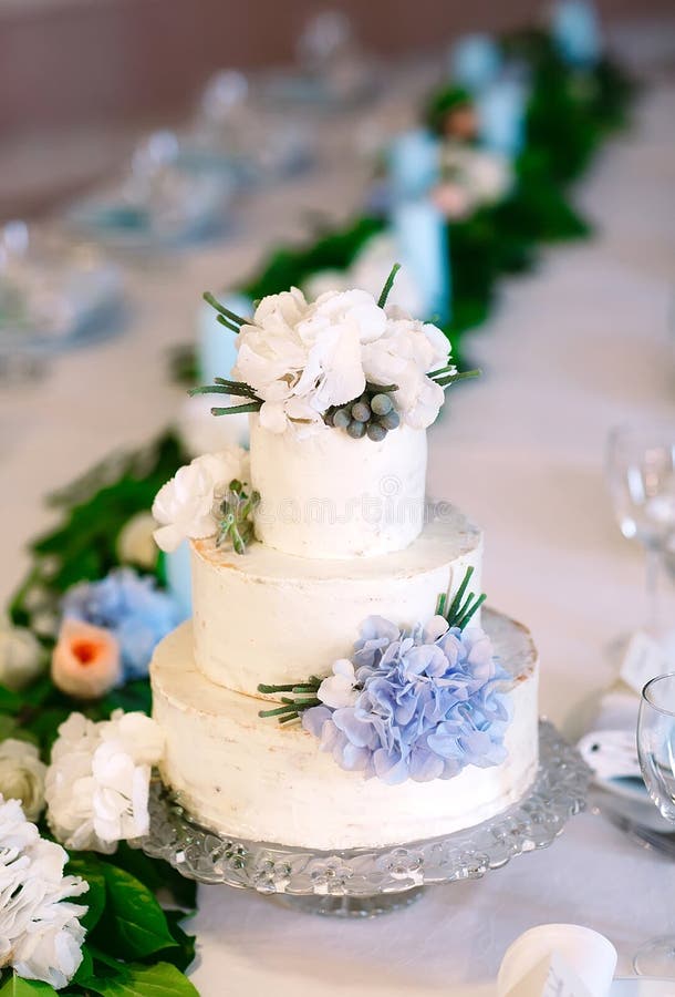 Wedding Cake on the White Wedding Table Stock Image - Image of plates ...