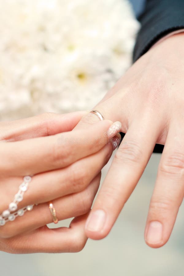 Two hands wedding rings stock image. Image of close, loving - 6826807