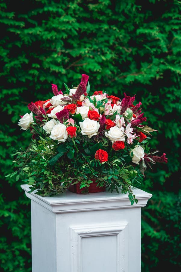 Wedding Ceremony. Column, Decorated with Bouquet of Red and White Roses ...
