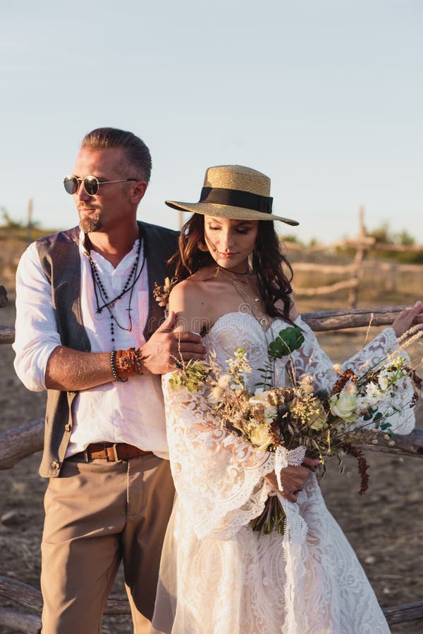Wedding Couple in the Boho Style on the Ranch. Designer Wedding Bouquet ...
