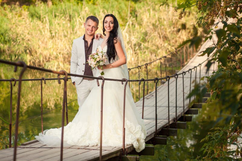 Wedding couple on bridge stock image. Image of wedding - 80925091