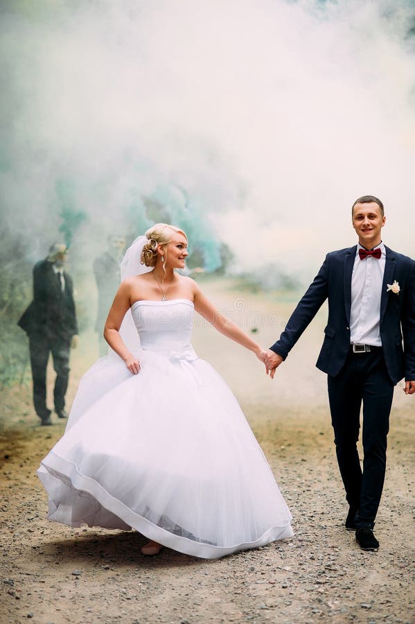 Wedding Couple with Color Smoke Stock Image - Image of cheerful ...