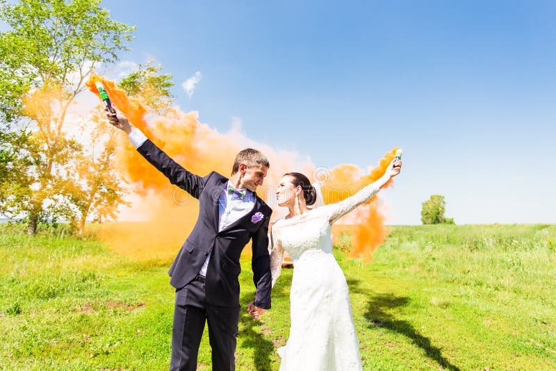 Wedding Couple with Color Smoke in the Summer Park Stock Photo - Image ...