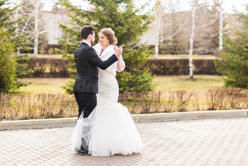Wedding Couple Dancing in the Park Stock Image - Image of gown ...