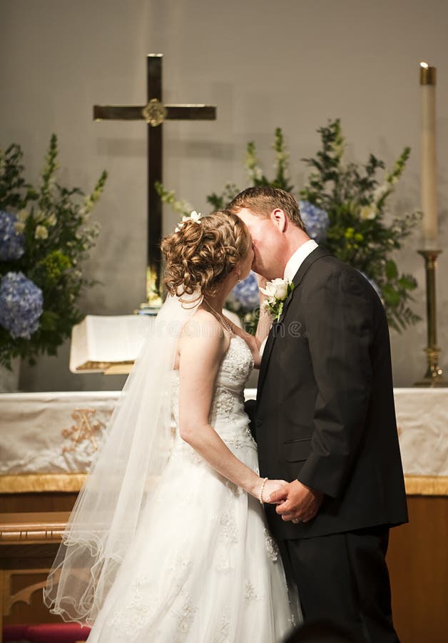 Wedding couple first kiss stock photo. Image of religious - 20331110