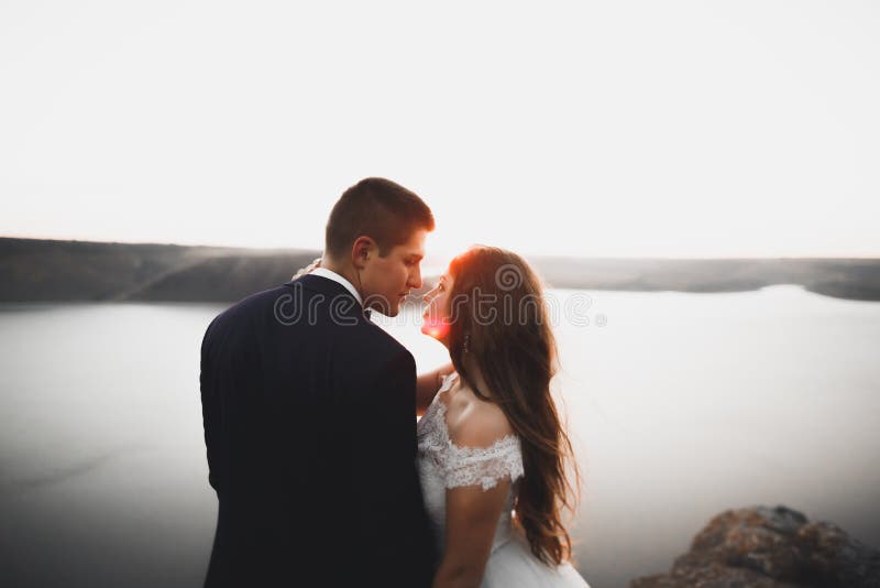 Wedding Couple, Groom, Bride Posing Near Sea on Sunset Stock Image ...