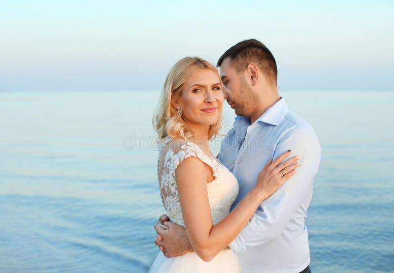 Wedding Couple. Groom Hugging Bride Stock Image - Image of people, male ...