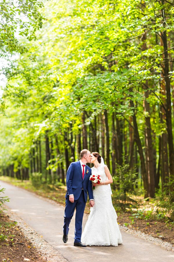 Wedding Couple Having Fun and Walk in the Park Stock Image - Image of ...
