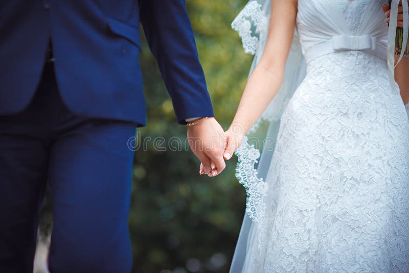 Wedding Couple Holding Hands Stock Image - Image of event, male: 50244455