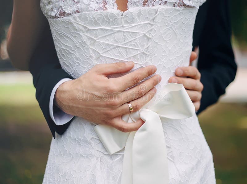 Wedding Couple Holding Hands and Hugging Stock Photo - Image of bride ...