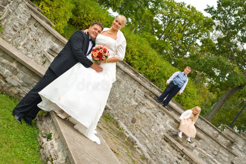Wedding couple with kids stock photo. Image of faithful - 13072192