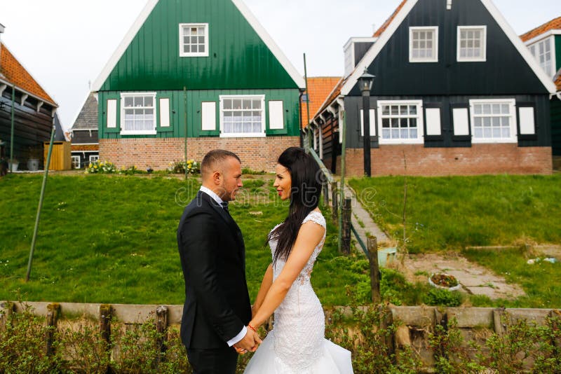 Wedding Couple Posing in Front of a House Stock Image - Image of ...