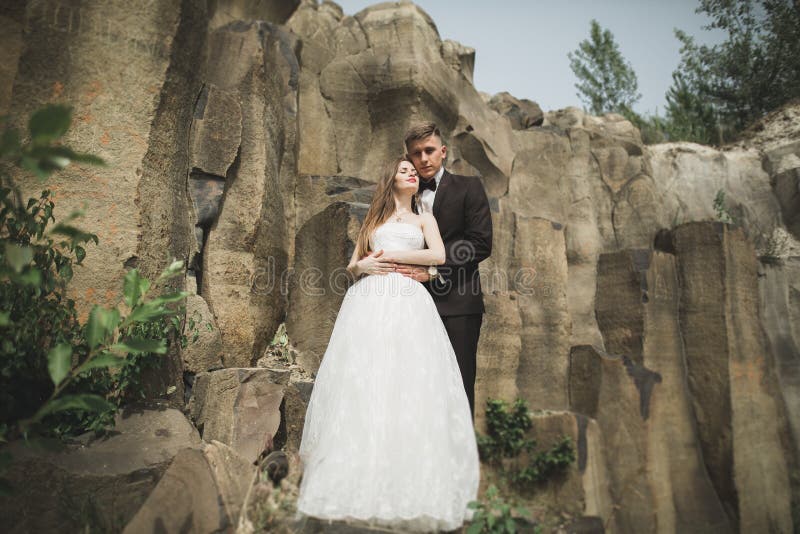 Wedding Couple Posing on Great Stones. the Bride and Groom Stock Photo ...