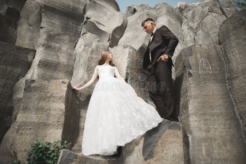 Wedding Couple Posing on Great Stones. the Bride and Groom Stock Photo ...