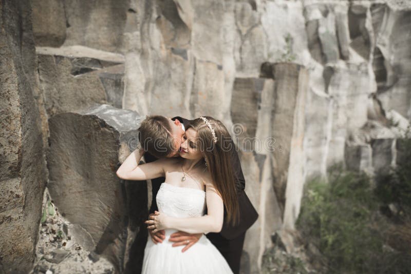 Wedding Couple Posing on Great Stones. the Bride and Groom Stock Photo ...