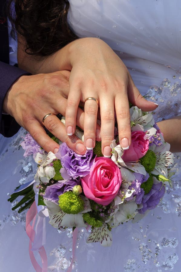 Wedding Couple Showing Rings Stock Image - Image of flowers, wife: 56850403