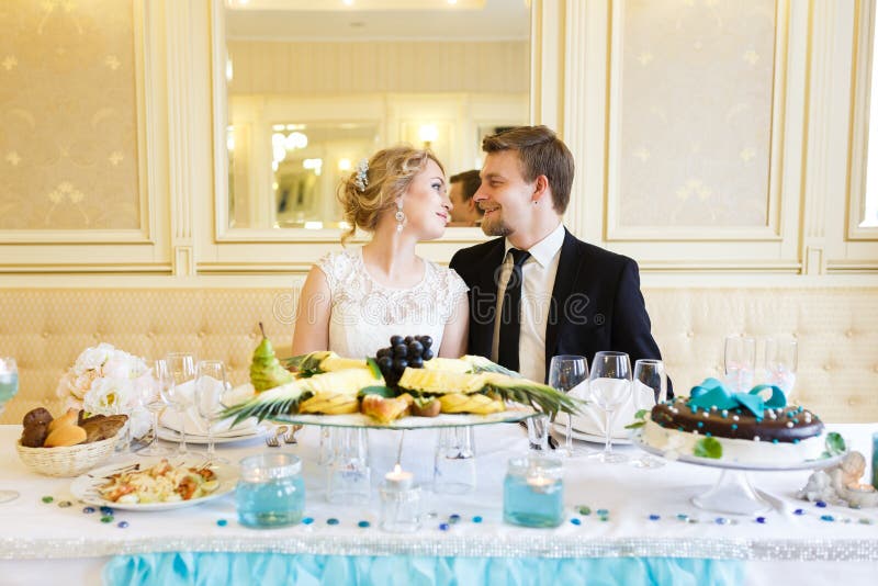 Wedding Couple at the Table Stock Photo - Image of interior, inside ...