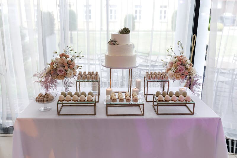 Cake table setup stock image. Image of assorted, table - 314980119