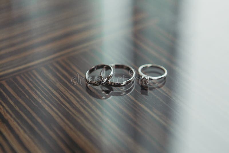 Wedding Diamond Gold Rings Engagement Rings on Table Stock Photo ...