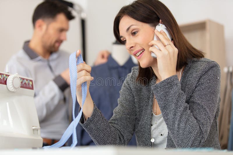 Wedding Dress Designer Working with Smart Phone Stock Photo - Image of ...