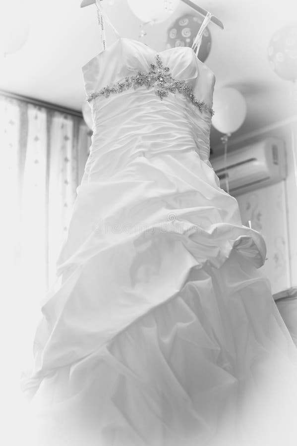 Wedding Dress Hanging on a Shoulder Stock Image - Image of gown ... Wedding Dress Hanging on a Shoulder Stock Image - Image of gown ...