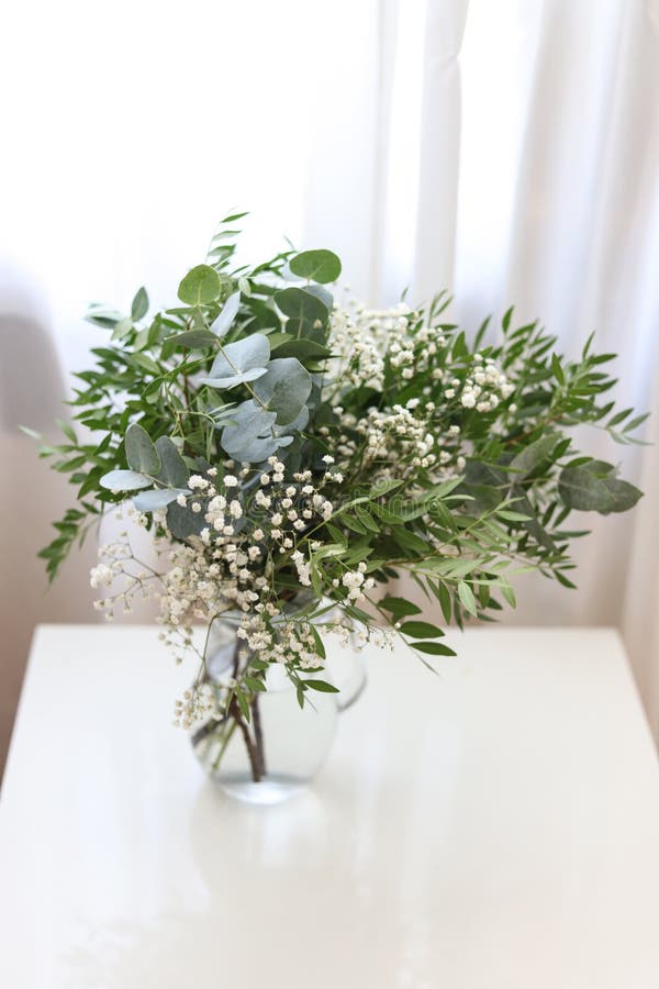 Flower Bouquet in a Glass Vase on a White Table Stock Image - Image of ...