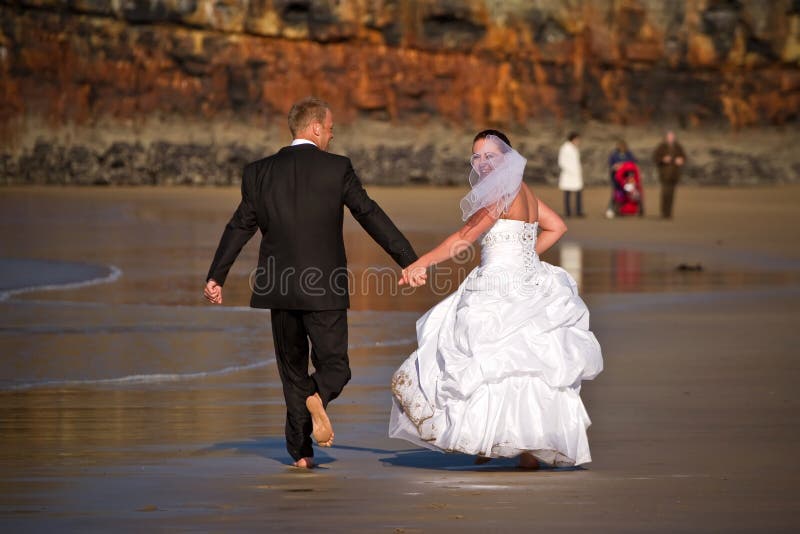 Wedding fun on the beach stock image. Image of horizontal - 17114827