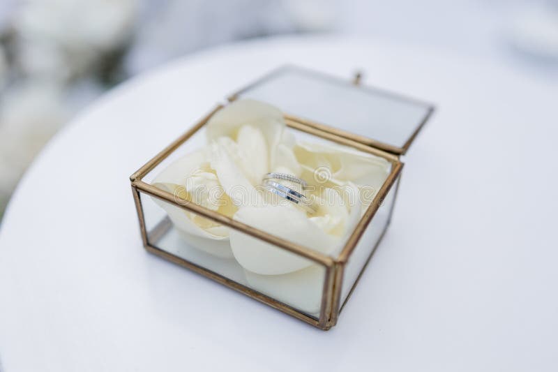 Wedding Gold Rings on a Ceremony Table Stock Photo - Image of candles ...