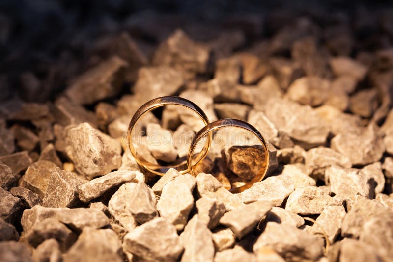 Wedding Gold Rings on the Rocks Stock Photo - Image of holiday, gold ...