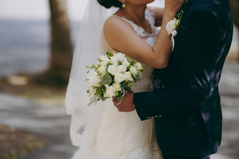 Wedding Groom with Brides Bouquet of Flowers Stock Photo - Image of ...