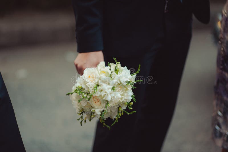 Wedding Groom with Brides Bouquet of Flowers Stock Image - Image of ...