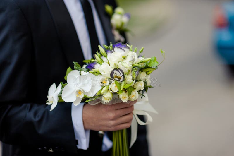 Wedding Groom with Brides Bouquet of Flowers Stock Image - Image of ...