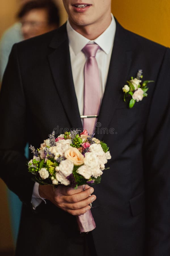 Wedding Groom with Brides Bouquet of Flowers Stock Image - Image of ...