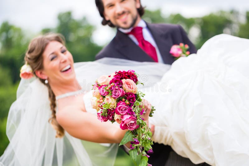 Wedding Groom Carrying Bride on Arms Stock Photo - Image of bridegroom ...