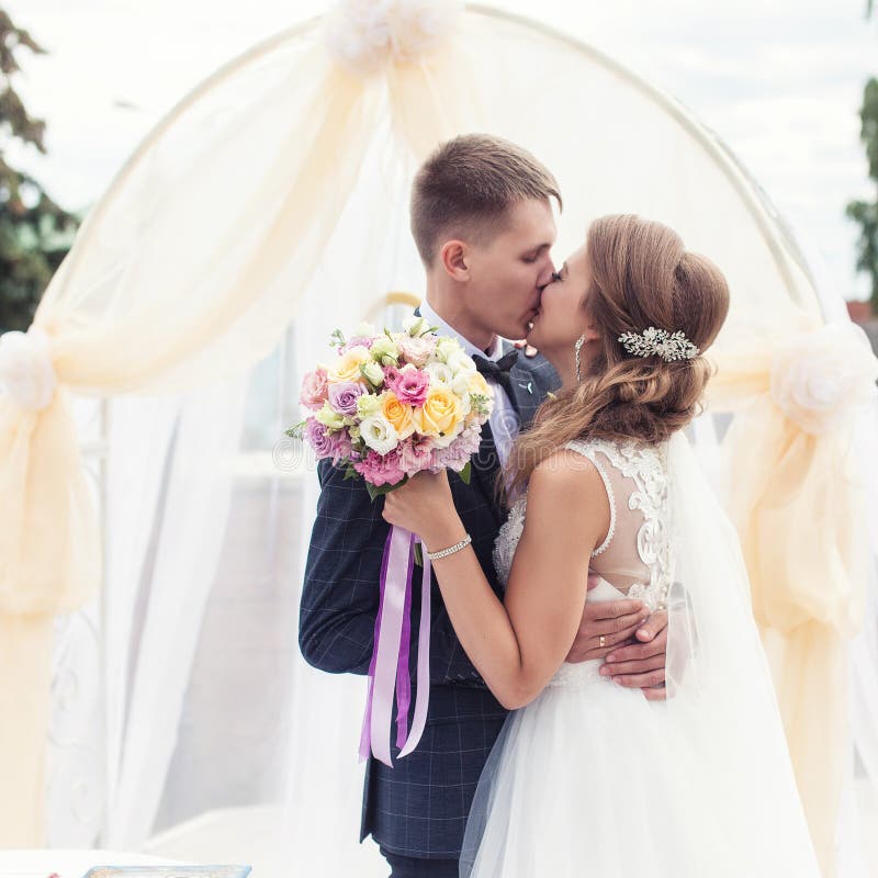 Wedding. Kiss of the Bride and Groom Stock Photo - Image of beautiful ...