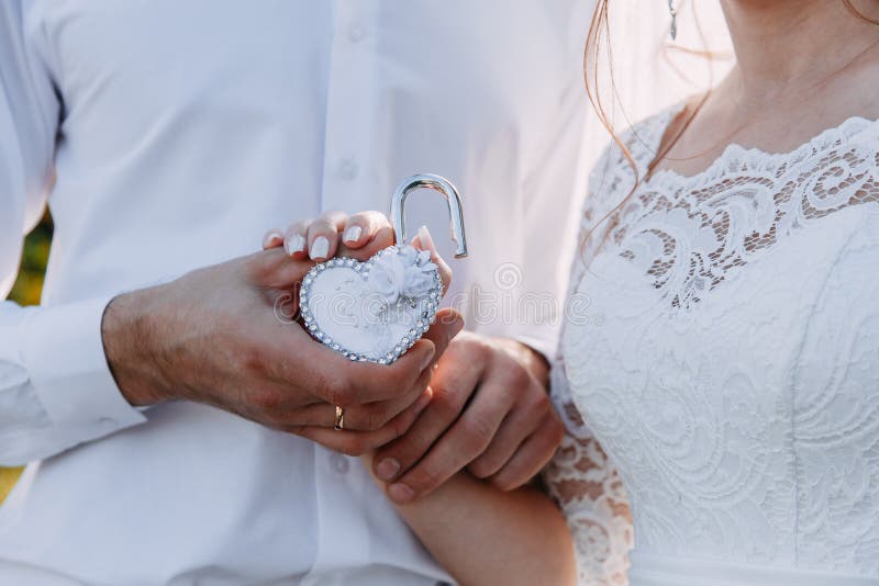 Wedding Lock and Key As Symbol of Marriage in Hands of Bride and Groom ...