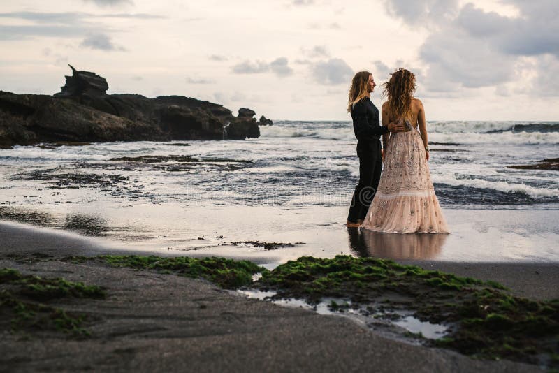 Wedding Lovestory Just Married Couple Near The Ocean At Sunset Stock