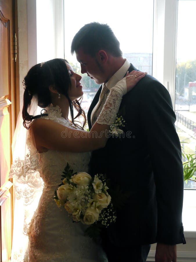 Wedding Party. the Bride and Groom Look at Each Other. Stock Photo ...
