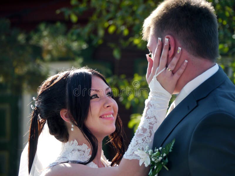 Wedding Party. the Bride and Groom Look at Each Other. Stock Photo ...