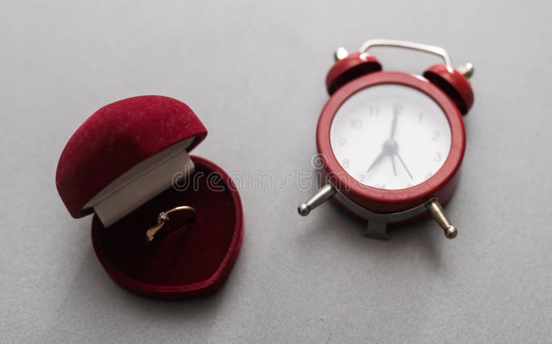Wedding Ring, Alarm Clock Tell Time in Life. Stock Image - Image of ...