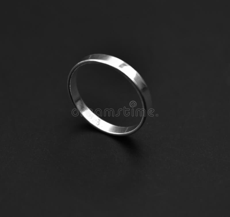 Wedding Ring on a Black Background. Close-up. Stock Image - Image of ...