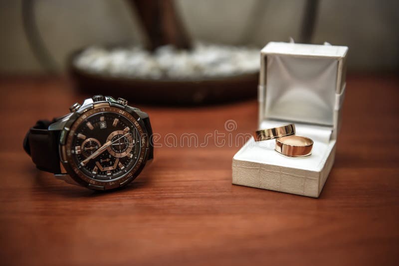 Wedding Ring in a Box and Watch the Groom Stock Image - Image of ...