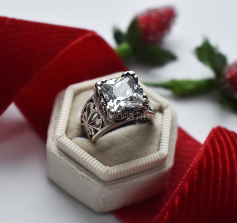 Wedding Ring with Diamond and Red Ribbon on White Background. Stock ...