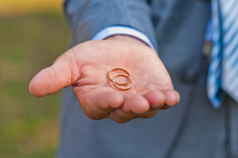 Wedding ring in hand stock photo. Image of gold, golden - 25984578