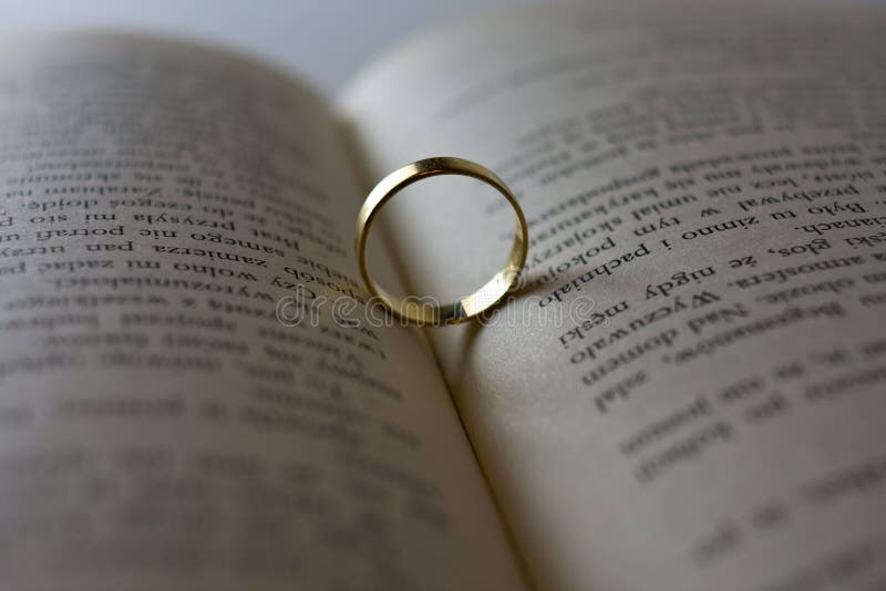 Wedding Ring Lying on an Open Book Stock Photo - Image of ceremony ...