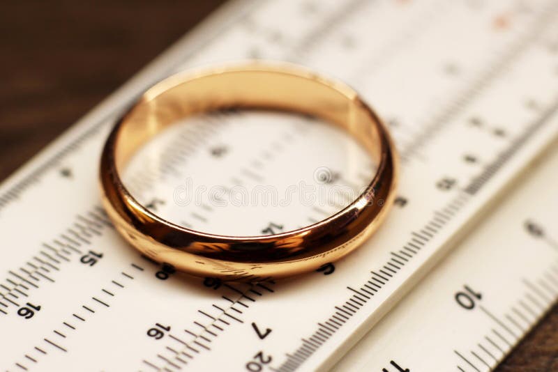 Wedding Ring and Measuring Device Stock Photo - Image of macro, metal ...