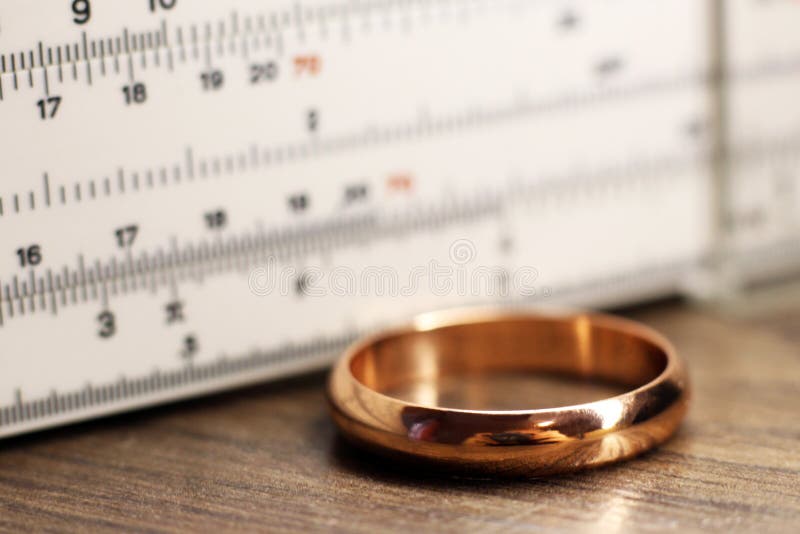 Wedding Ring and Measuring Device Top View, Vintage Stock Image - Image ...