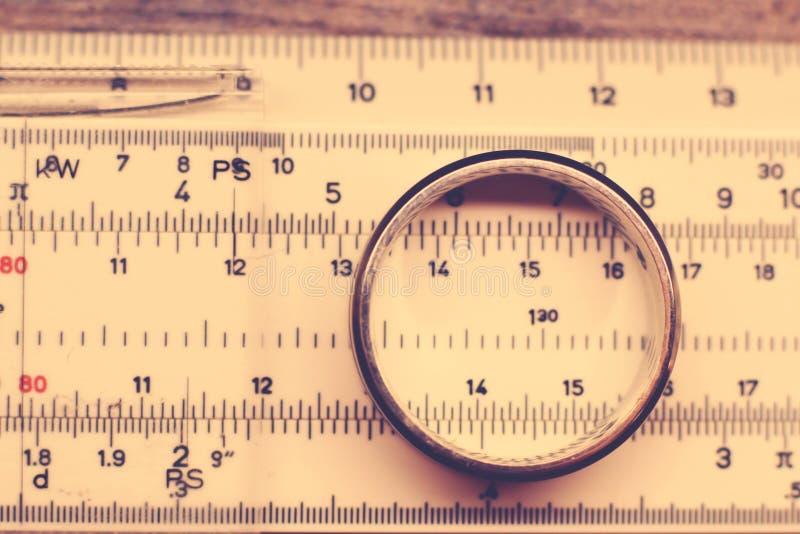 Wedding Ring and Measuring Device Top View, Vintage Stock Photo - Image ...